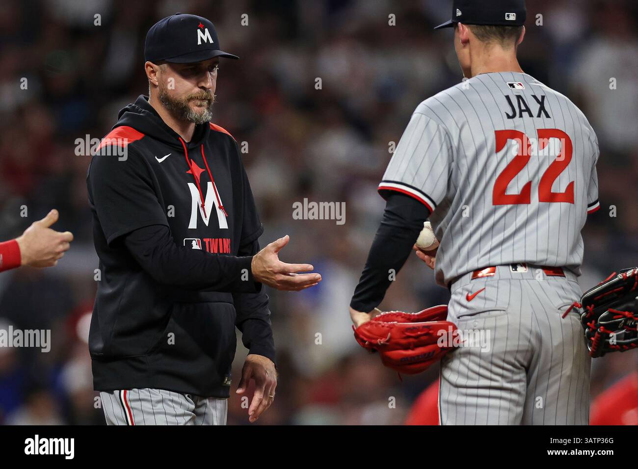 Minnesota Twins manager Rocco Baldelli, left, relieves pitcher Griffin ...