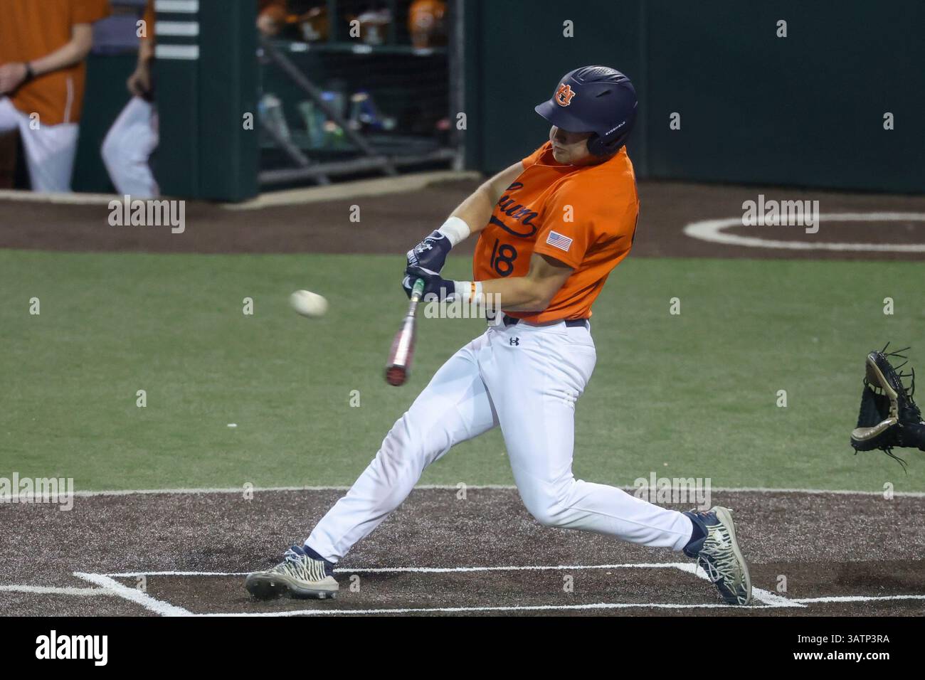 AUSTIN, TX - APRIL 18: Auburn catcher Ike Irish (18) hits a solo home ...