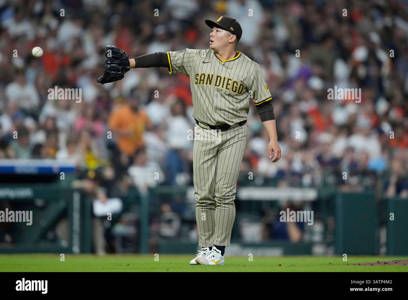San Diego Padres relief pitcher Yuki Matsui catches a ball during the ...
