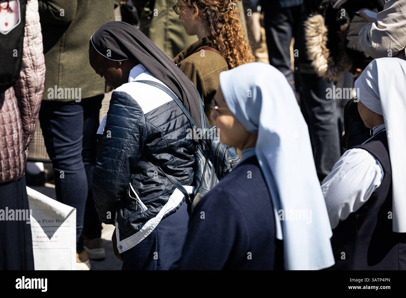 Paris, France. 18th Apr, 2025. Nuns kneel as they pray during a Good ...