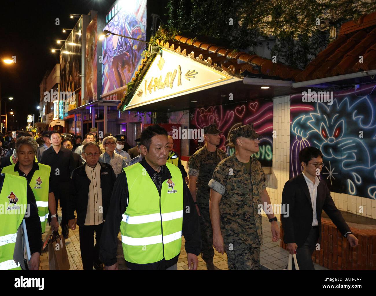 U.S. military and Japanese government officials patrolling together on ...