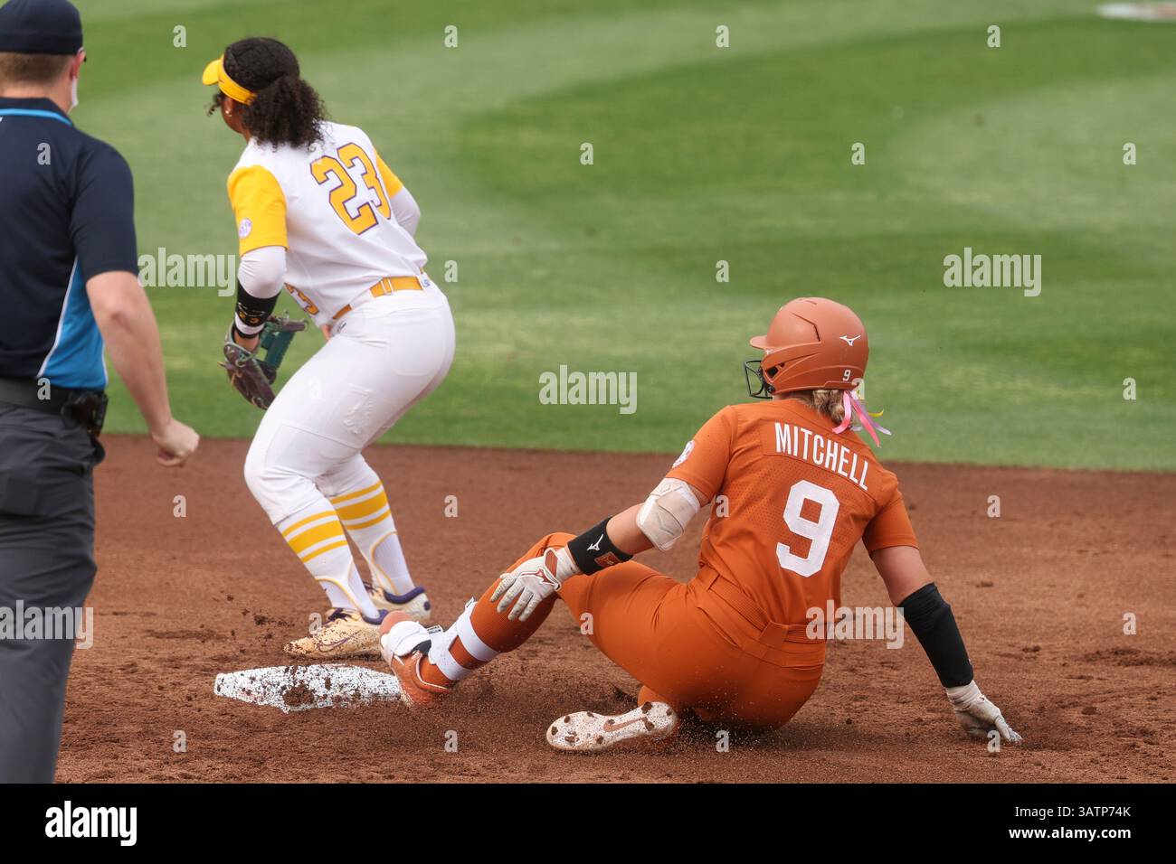 AUSTIN, TX - APRIL 18: Texas infielder Joley Mitchell (9) slides into ...