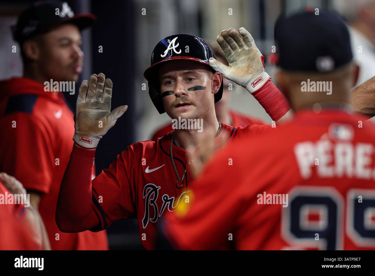 Atlanta Braves' Jarred Kelenic (24) high fives teammates after hitting ...
