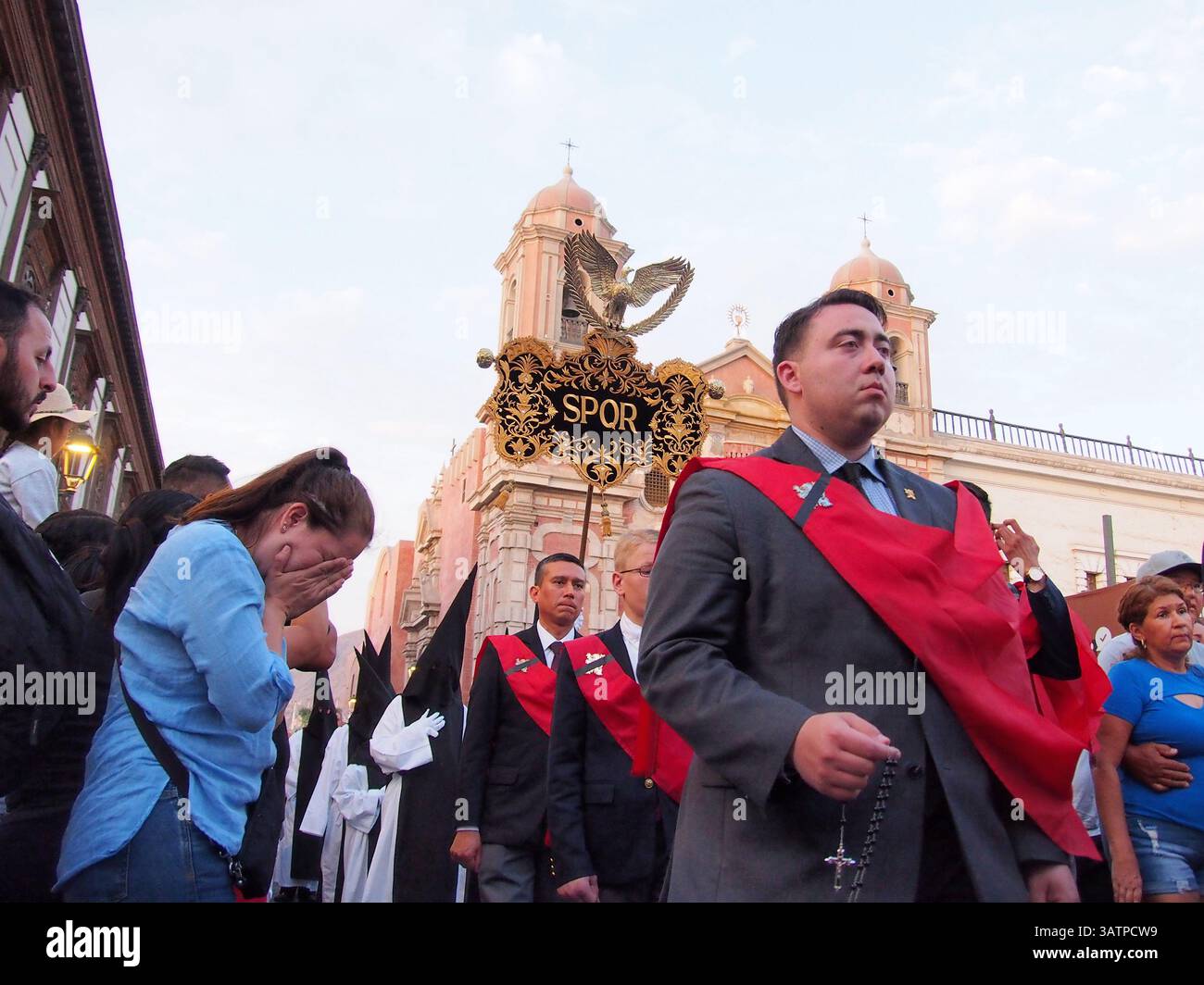Catholic devotees carrying on a religious procession at eve on Good ...
