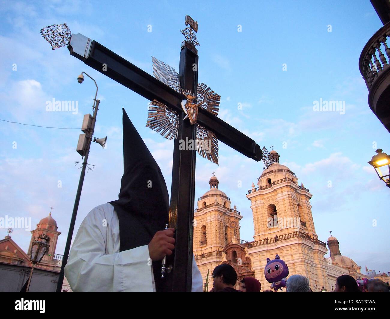Catholic devotees, Hooded and carrying a cross, carrying on a religious ...