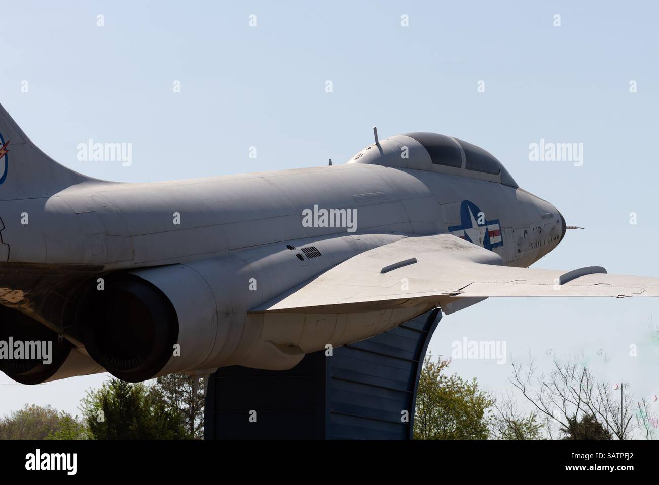 A U.S. Air Force F-101 Voodoo jet fighter displayed outdoors on a stand ...
