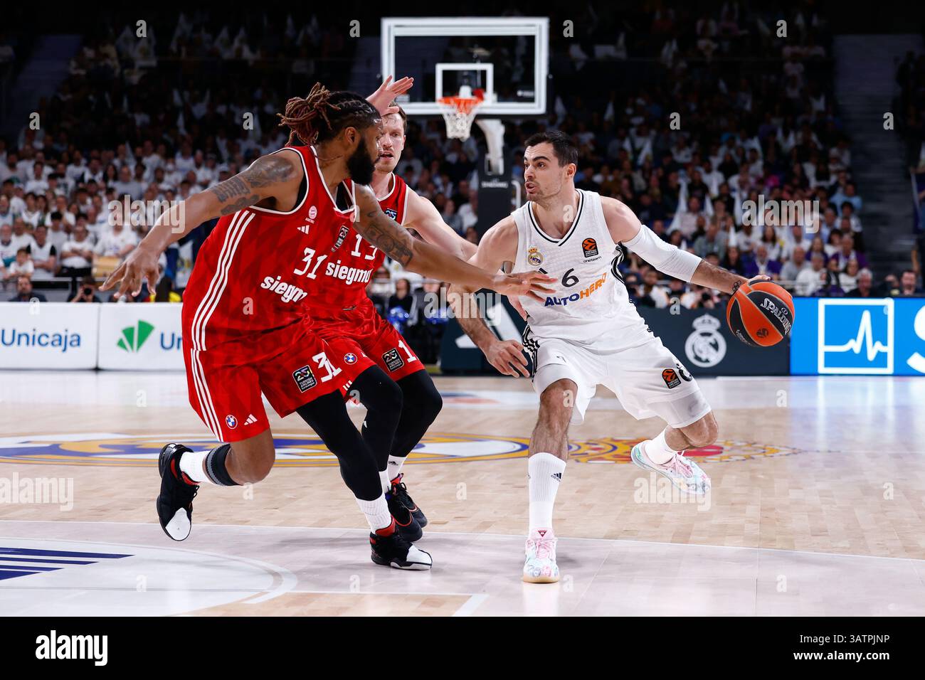 Alberto Abalde Diaz of Real Madrid and Devin Booker of Bayern Munich ...