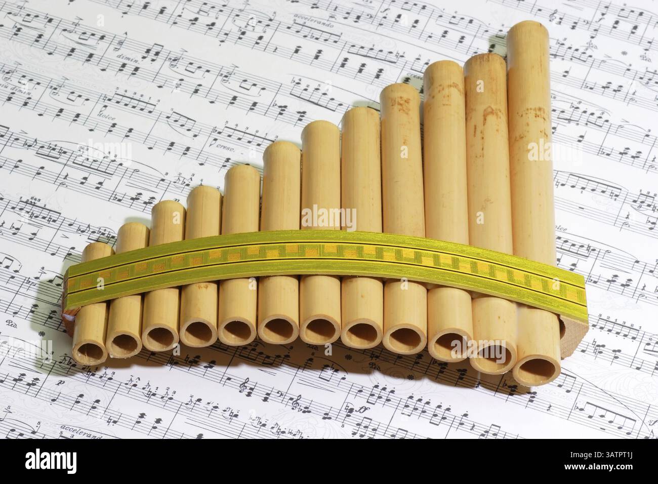 Pan flute on a sheet with notes Pan fluite on a sheet with notes Stock ...