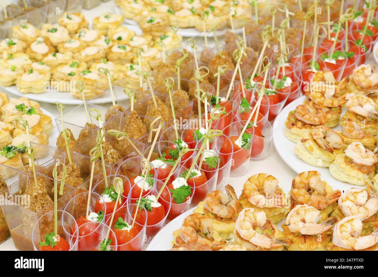 A lot of cold snacks on buffet table, catering Stock Photo - Alamy