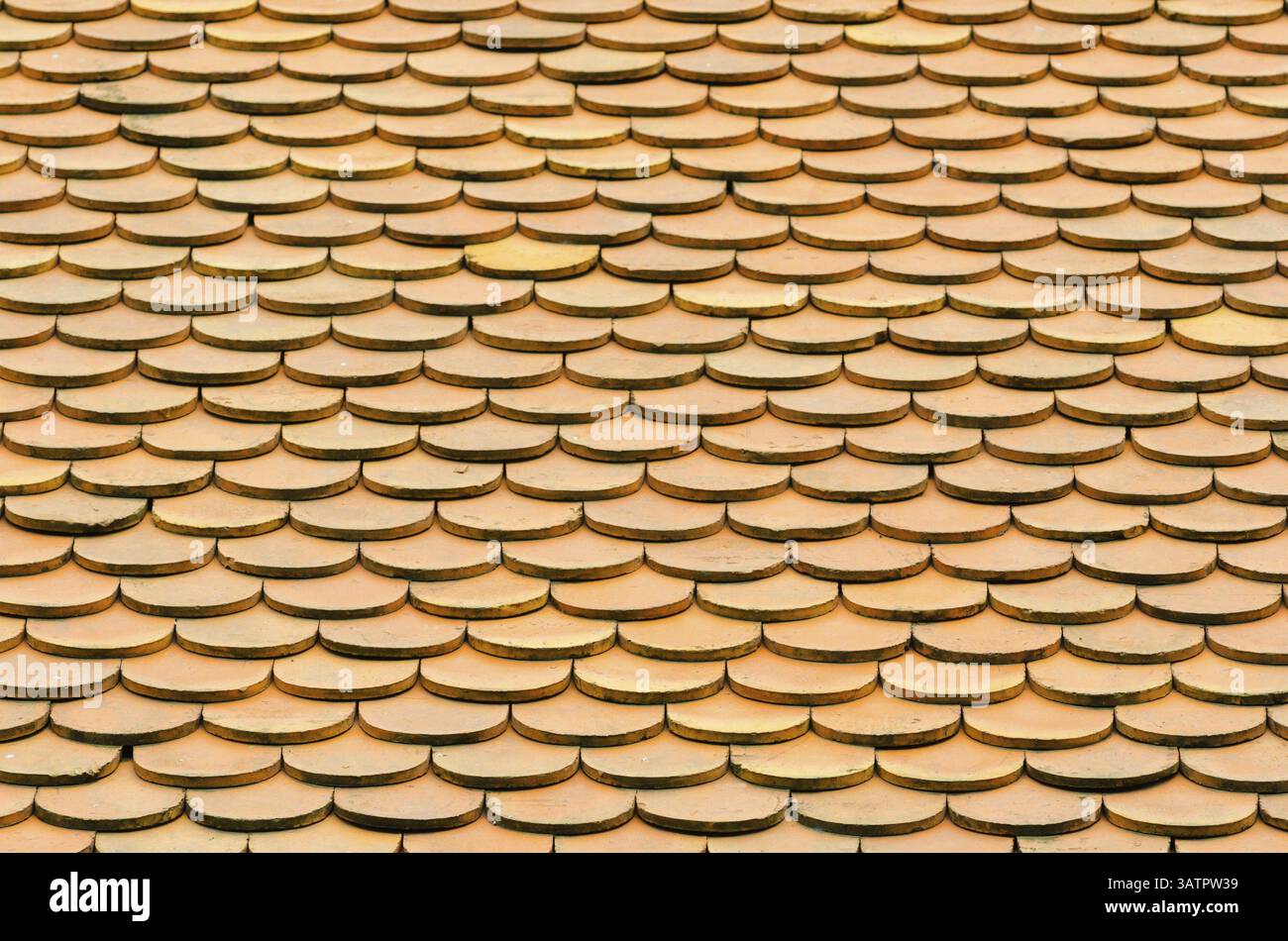A lot of rounded brown roof tiles Stock Photo - Alamy