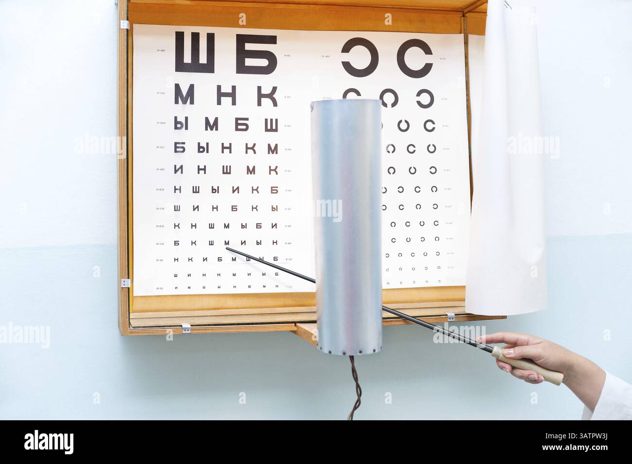 A Russian eye chart at an oculist and a hand with a pointer Stock Photo ...