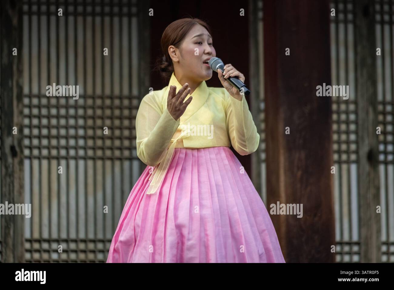 Korean woman wearing traditional dress hanbok performing on the stage ...