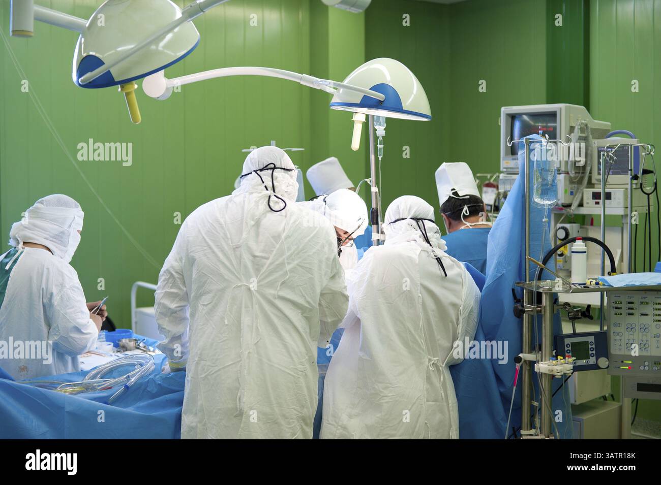 A real surgical operation in a green room Stock Photo - Alamy