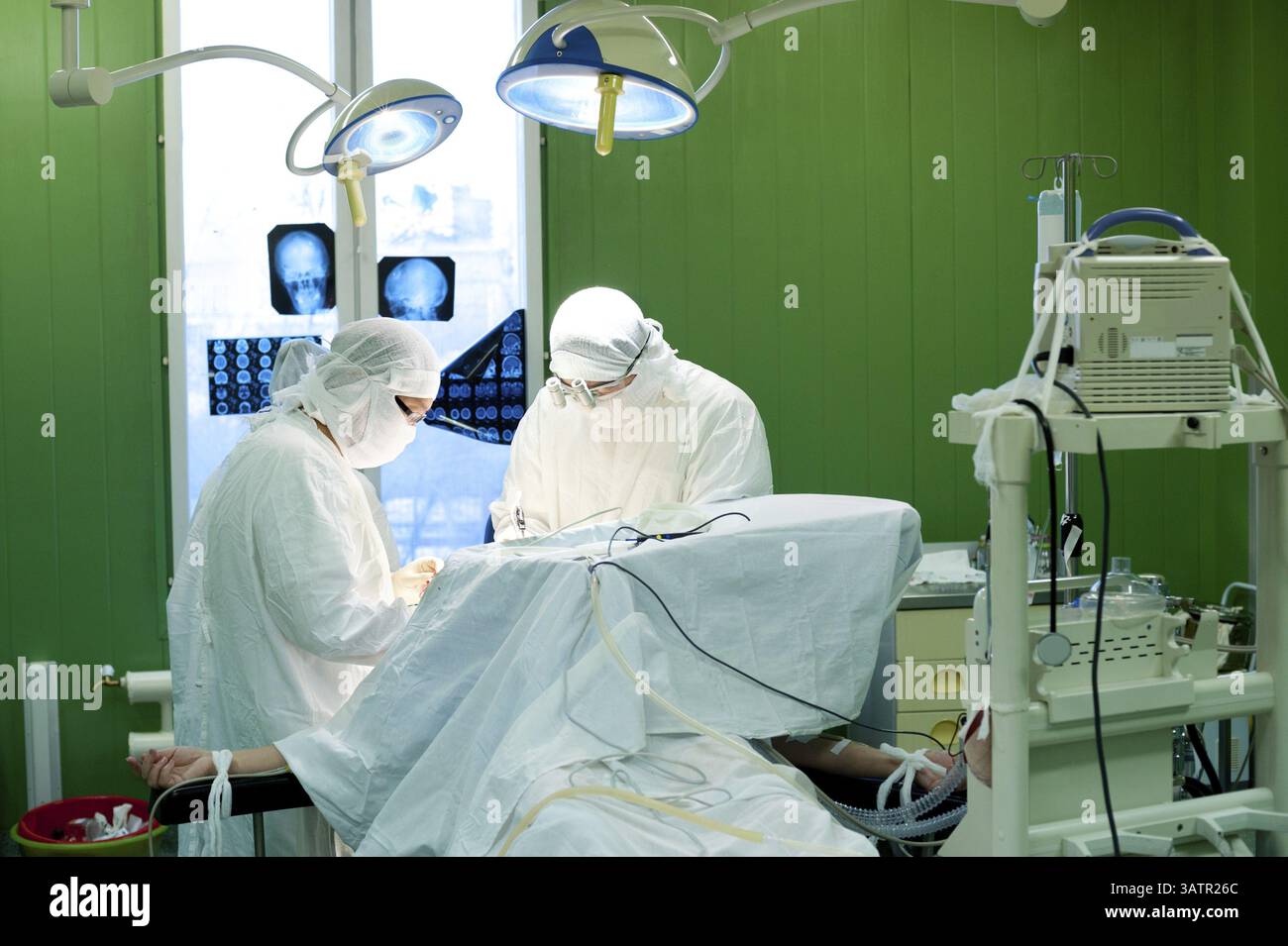 A real brain surgery, two surgeons at work Stock Photo - Alamy