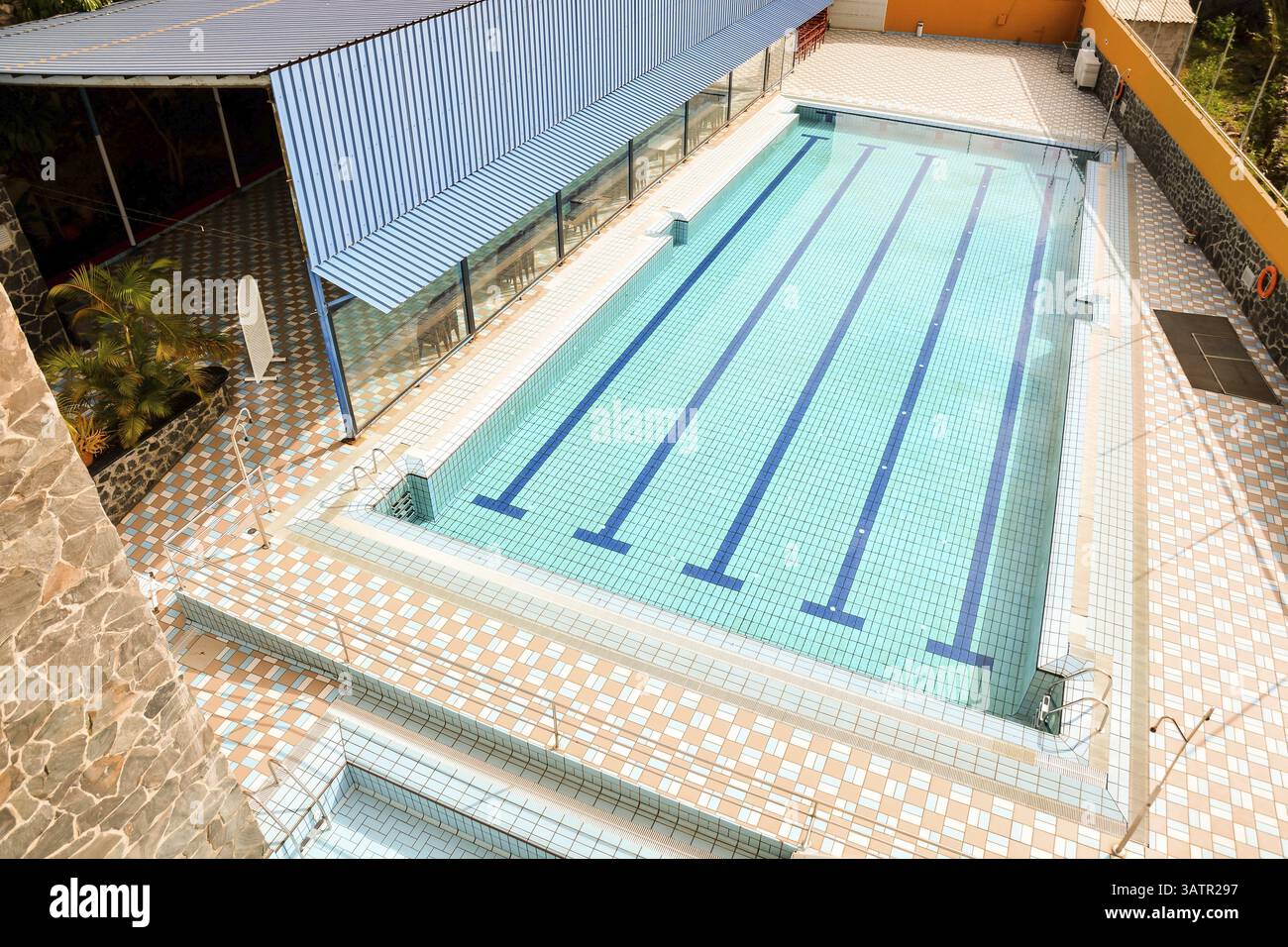 Backyard rectangular blue swimming pool in beautiful park Stock Photo ...