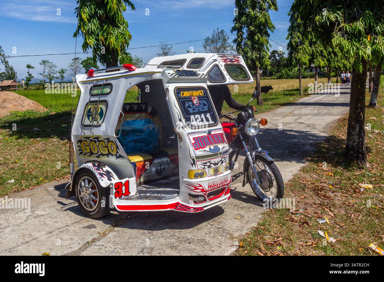 Colorful tricycle, a popular mode of public transportation in the ...