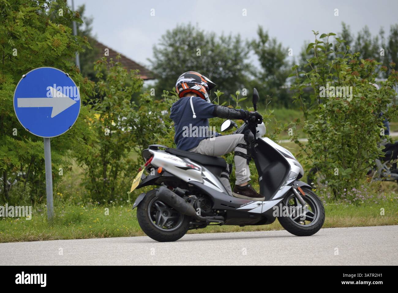 Moped riding technique training on the practice area Stock Photo - Alamy