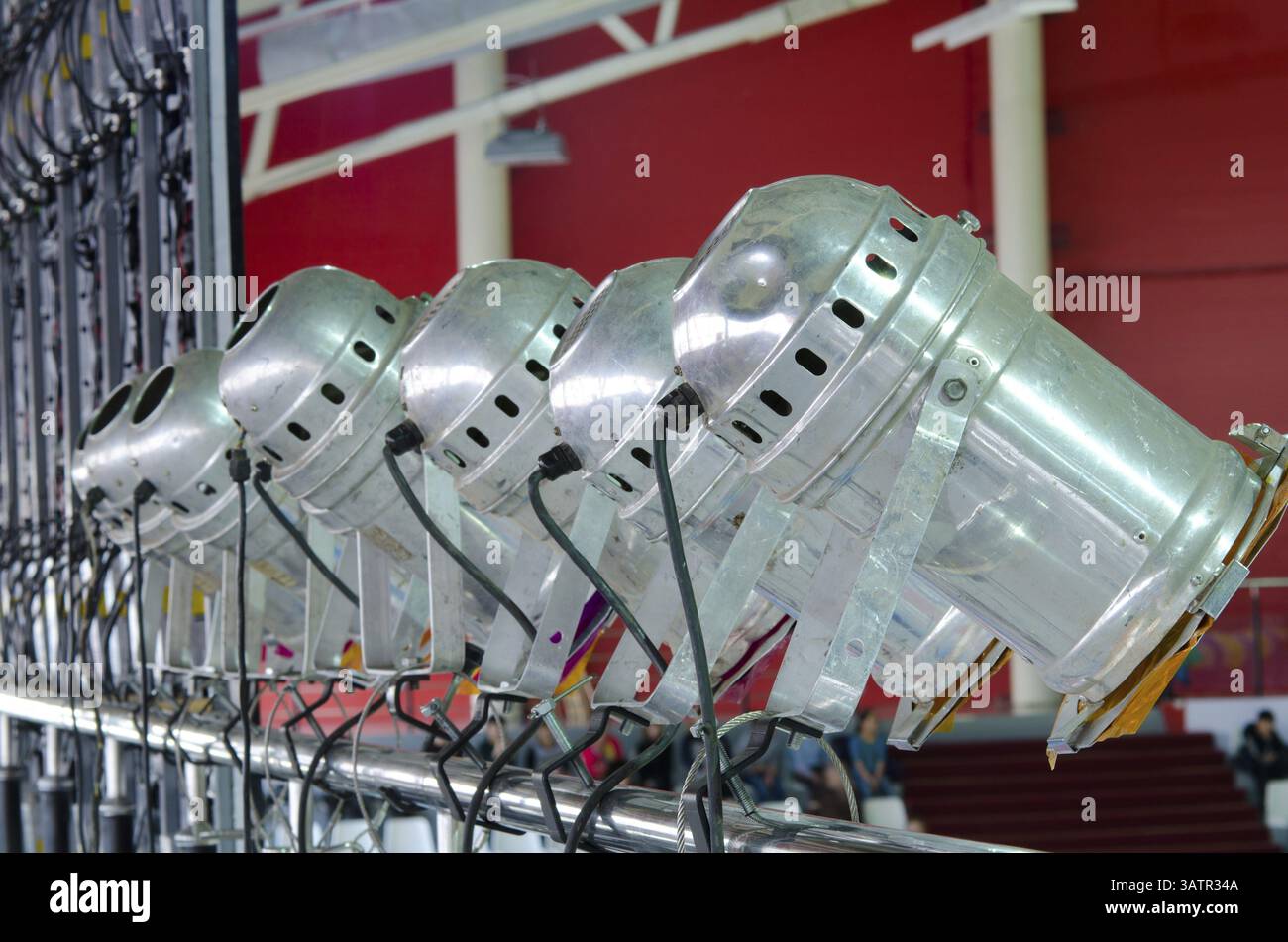 A line of metal spotlights in an indoor stadium Stock Photo - Alamy