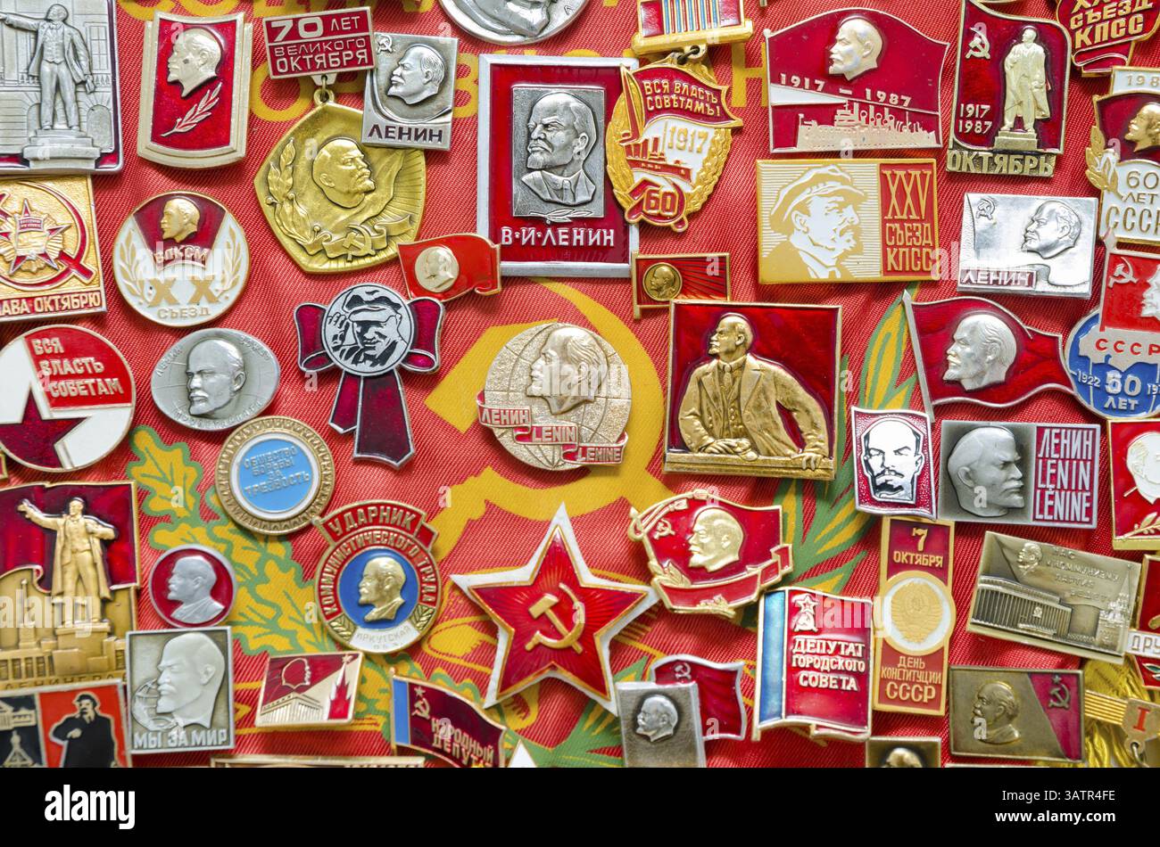 Many Soviet Union (former Russia) badges on red banner Stock Photo - Alamy