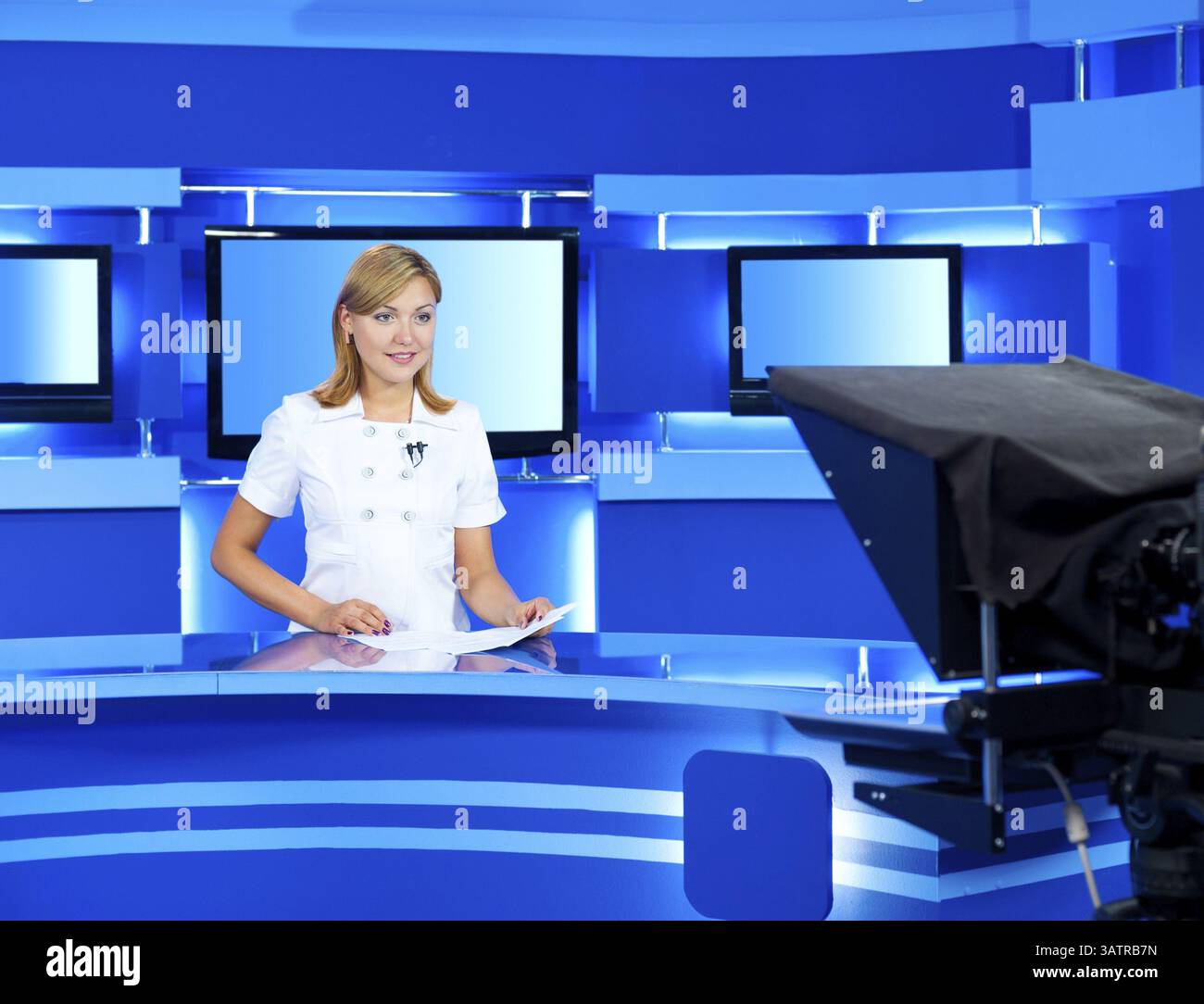 A television announcer at studio during live broadcasting Stock Photo ...