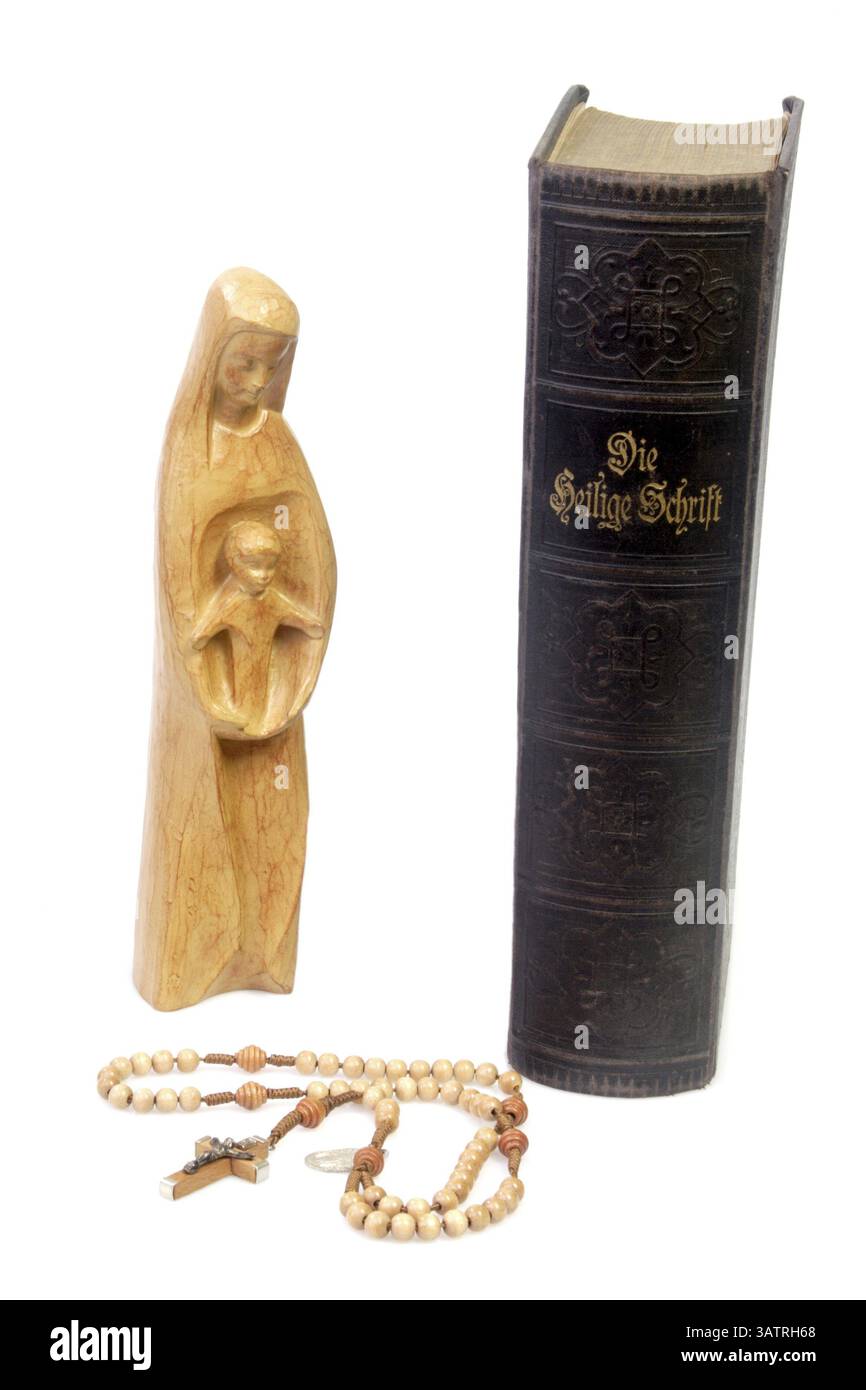 Madonna figure with ancient bible and rosary - isolated on white ...