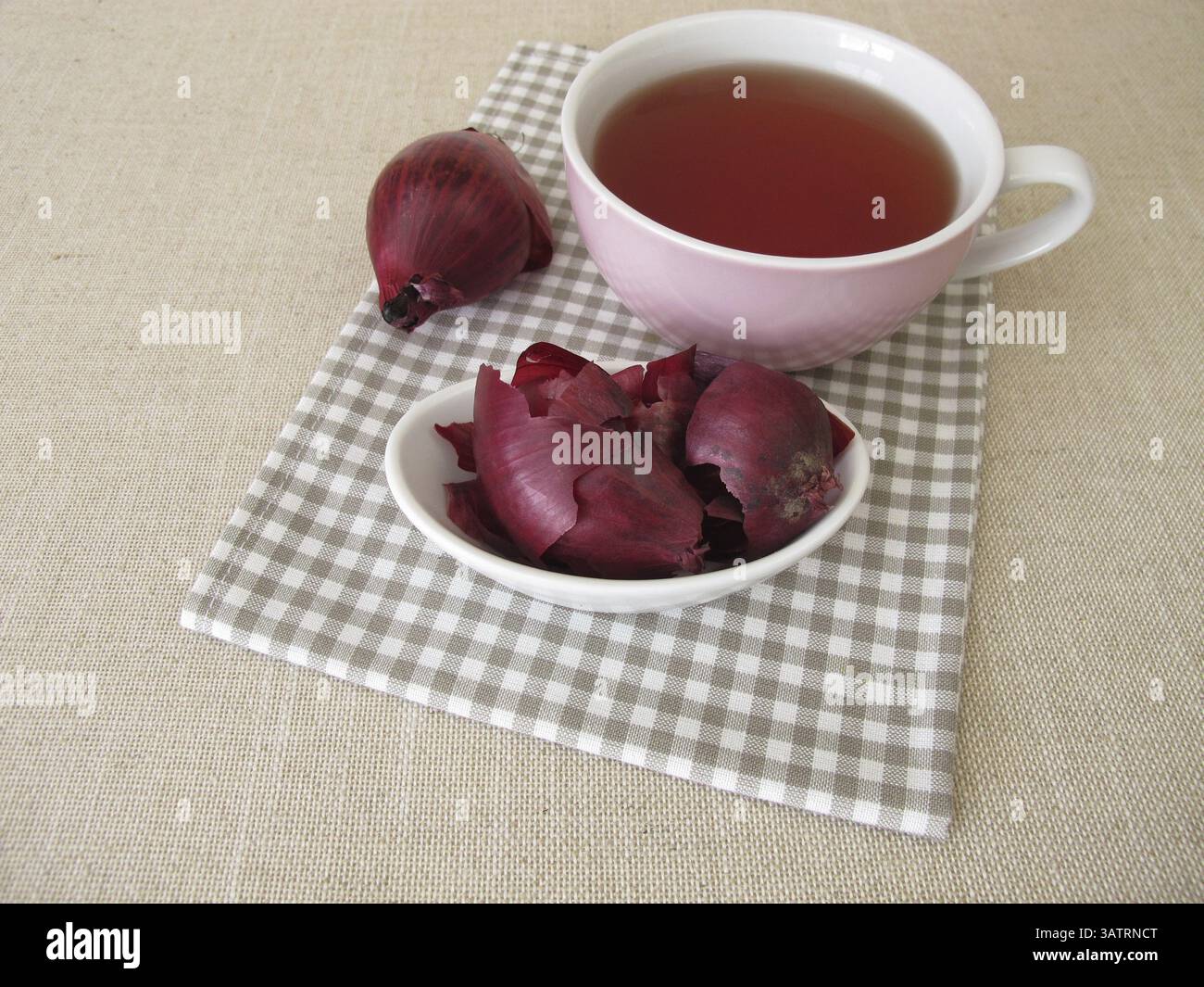 A cup of red onion skin tea, tea made from red onion skins Stock Photo ...