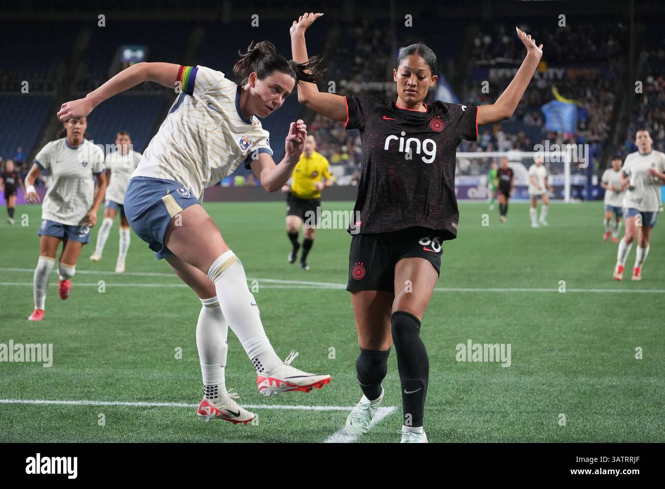 Seattle Reign FC defender Phoebe McClernon (21) clears the ball past ...