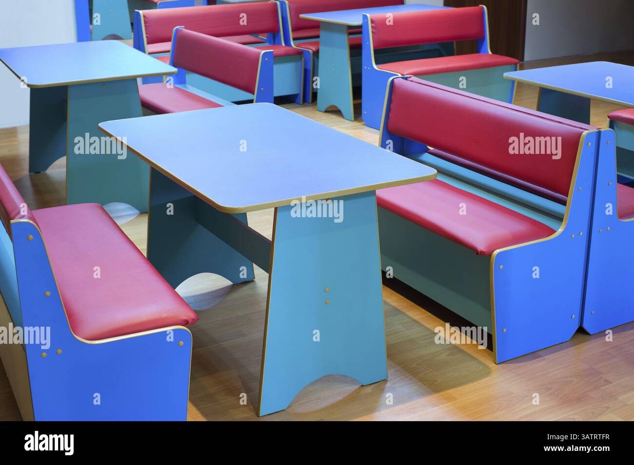 Children's furniture - some blue tables and benches Stock Photo - Alamy