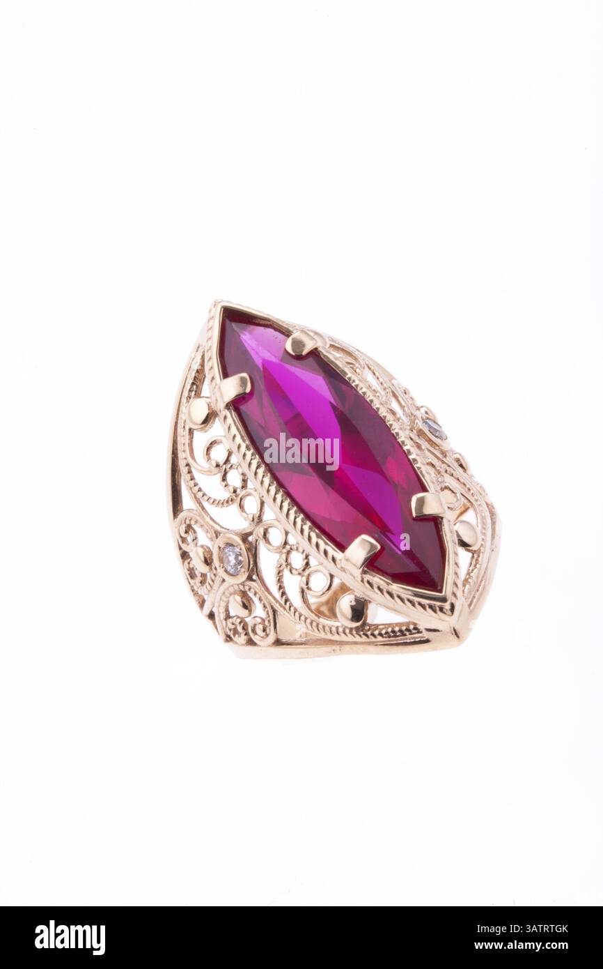 Golden ring with gem on isolated studio background Stock Photo - Alamy