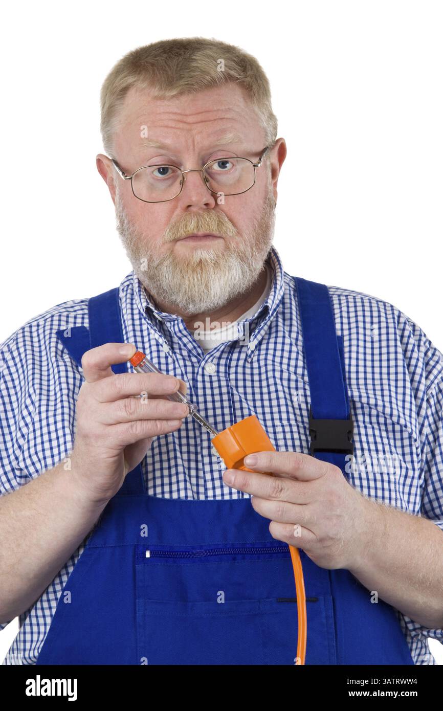 Electrician with phase tester and socket - cropped on a white ...