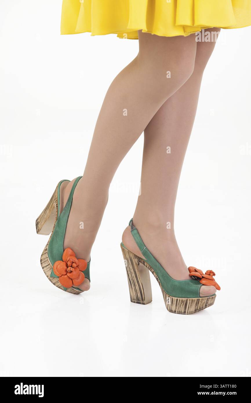 Woman's legs in shoes on isolated background Stock Photo - Alamy