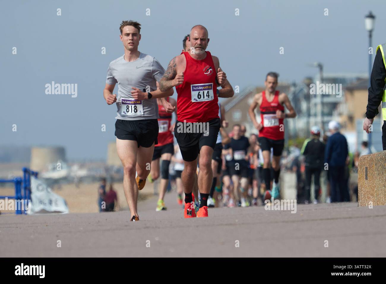 Runners on Marine Parade, Hythe, in the 2025 Folkestone 10 mile race ...