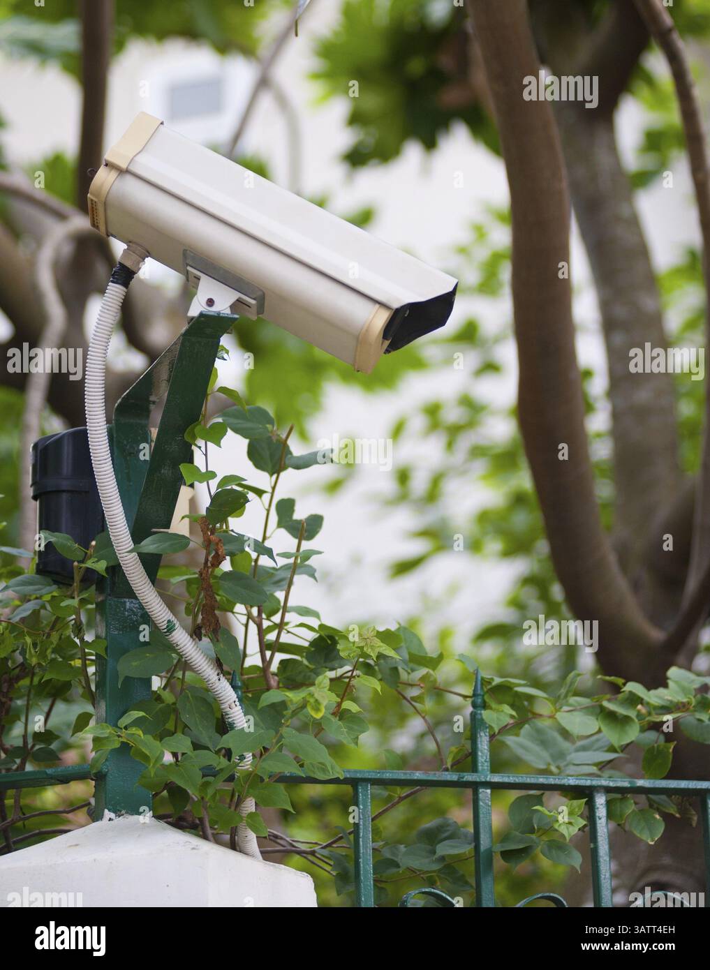 Outer video surveillance camera set on fence Stock Photo - Alamy