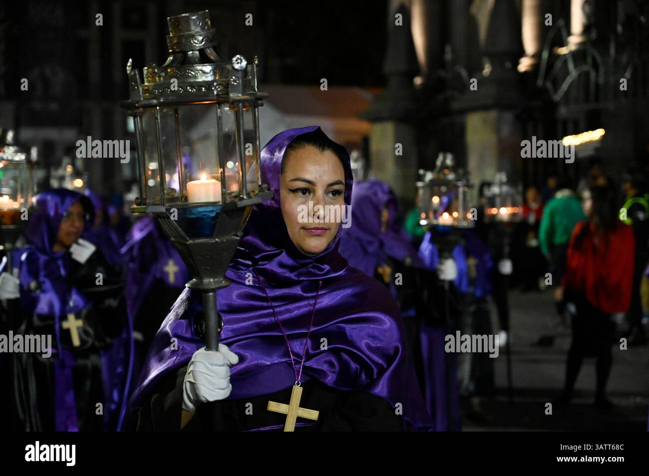 Toluca, Mexico. 18th Apr, 2025. A Hooded penitent carry a torche and ...