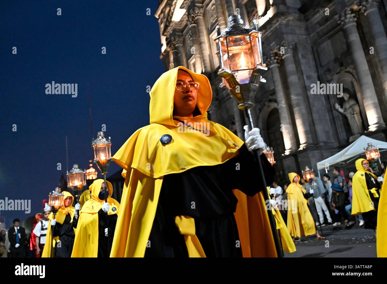 Toluca, Mexico. 18th Apr, 2025. A Hooded penitent carry a torche and ...