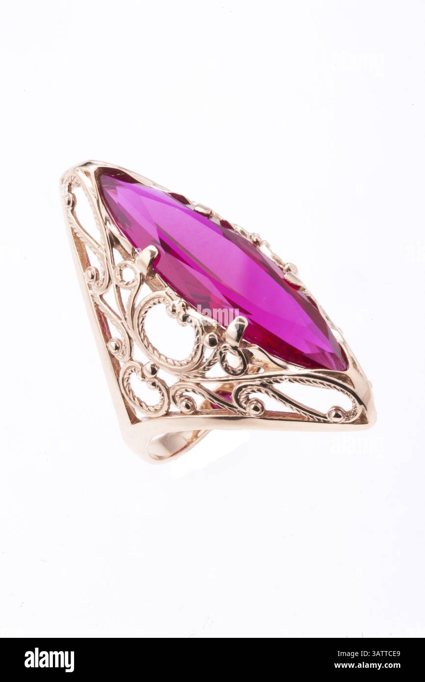 Golden ring with gem on isolated studio background Stock Photo - Alamy