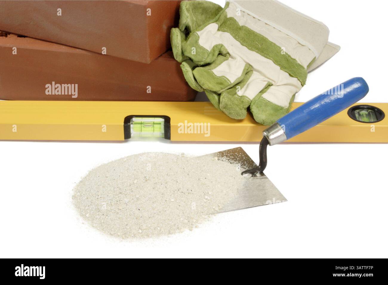 Mason's tools with building materials - cropped on a white background ...