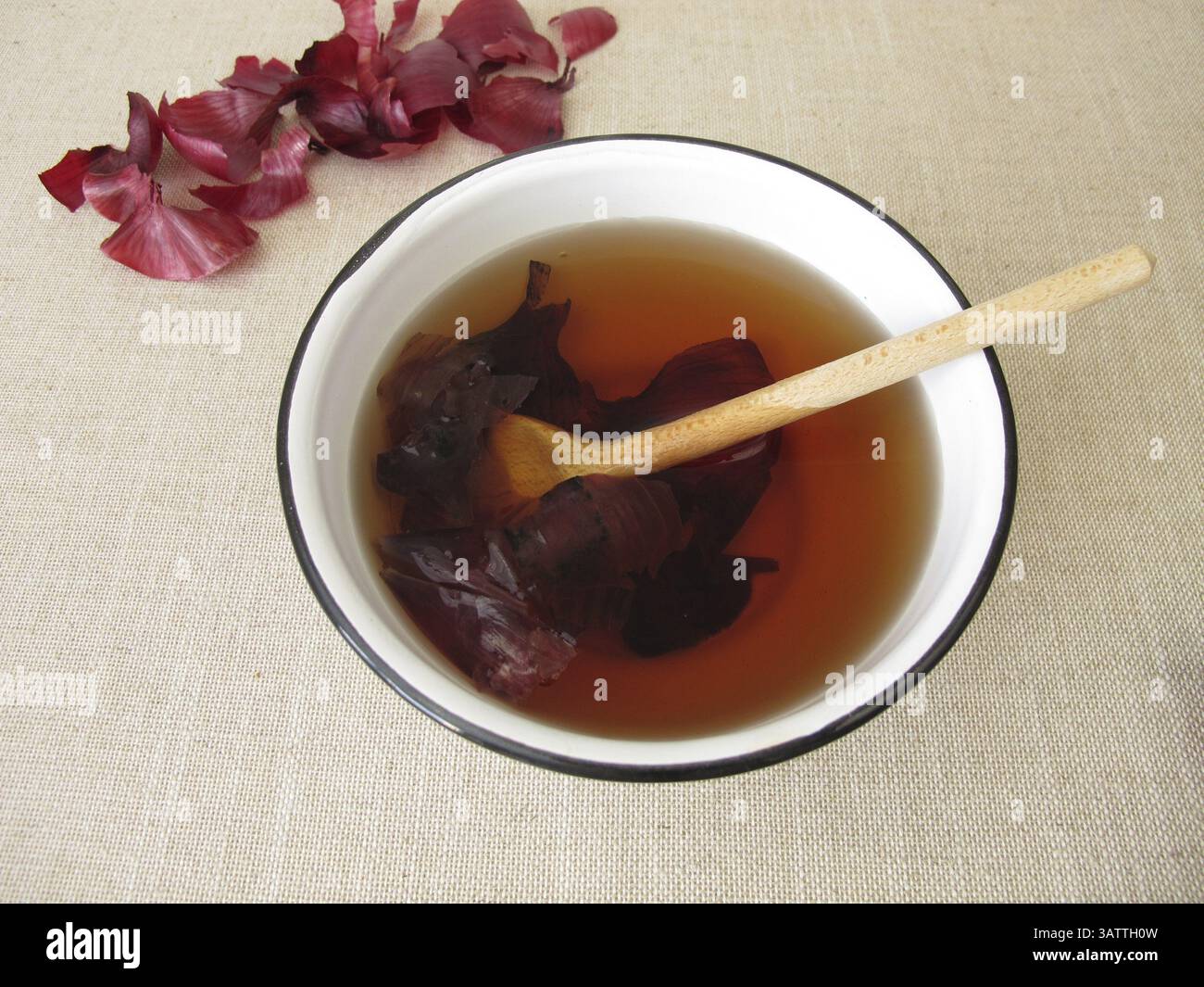 Colouring agent, red decoction of red onion skins in a bowl Stock Photo ...