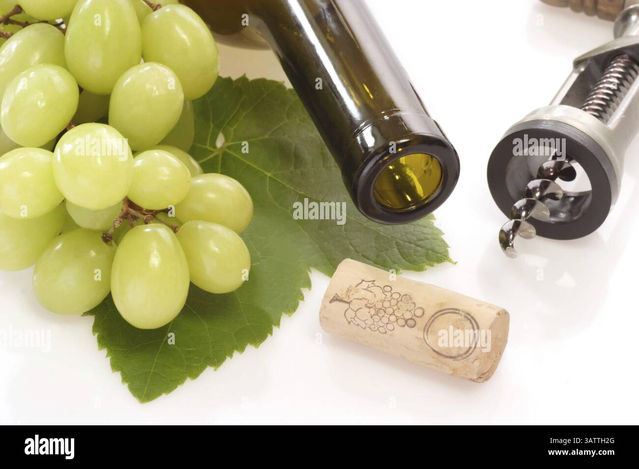 Wine cork, corkscrew and grapes on a white background Stock Photo - Alamy