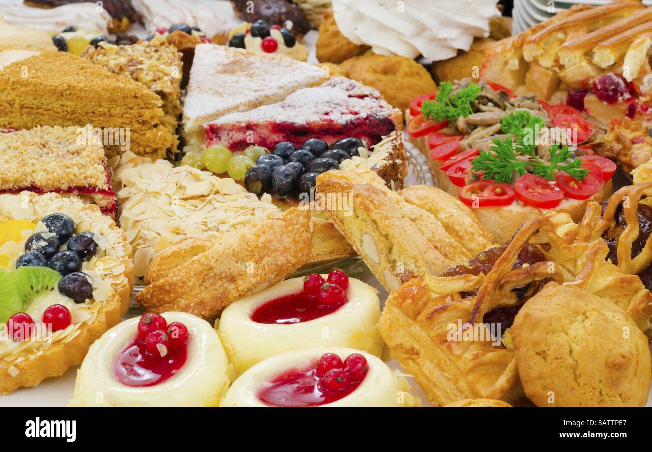 Many different kinds of dessert - cakes, sweets and pies Stock Photo ...