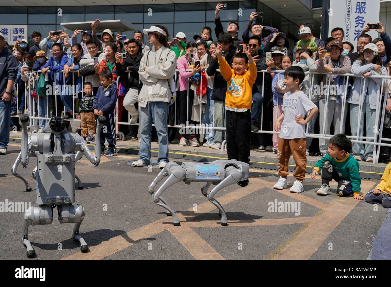 Spectators watch four legged robot performance after the Humanoid Robot ...