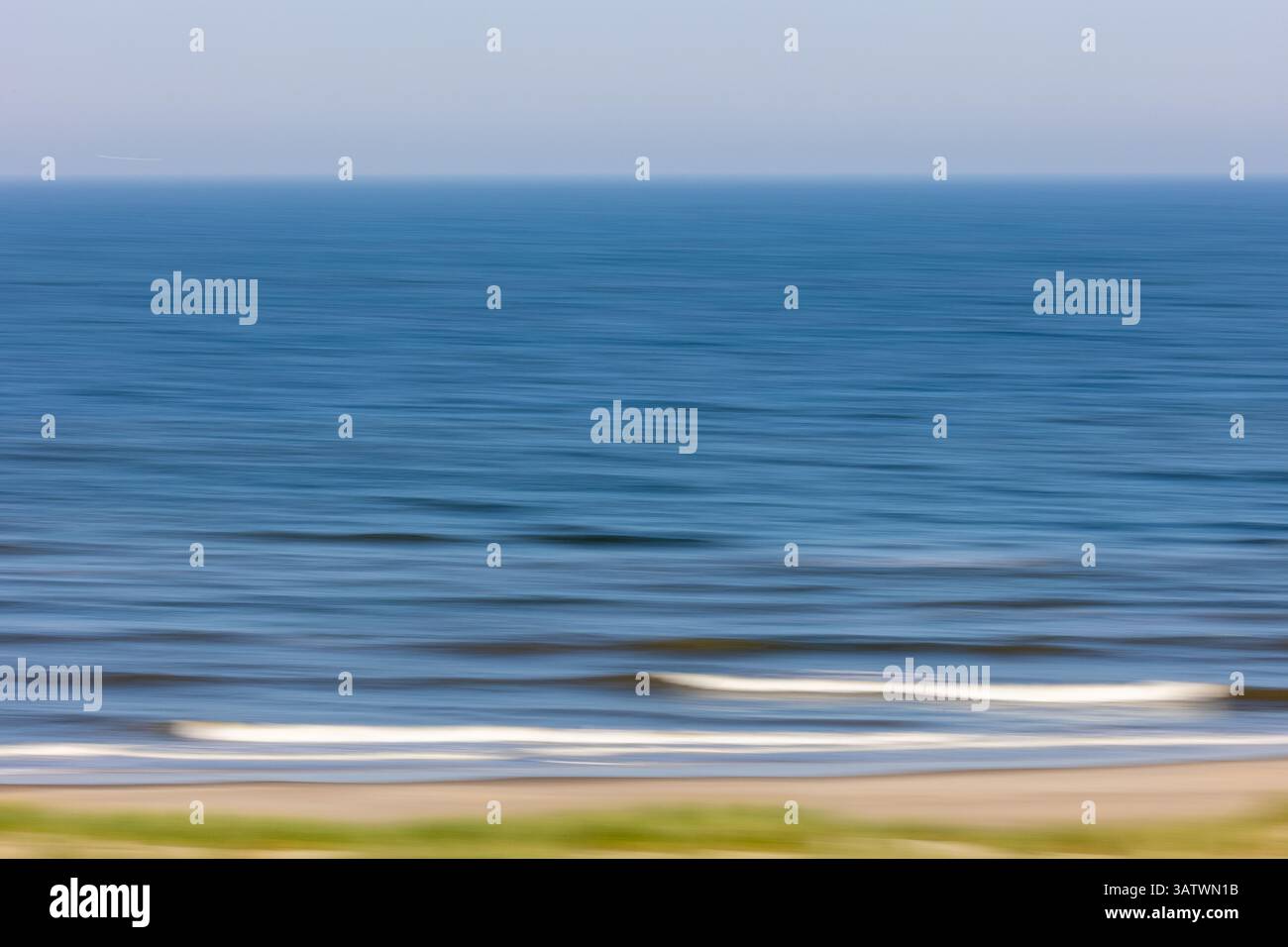 Soft pastel colors blend seamlessly in a blurred ocean scene, creating ...