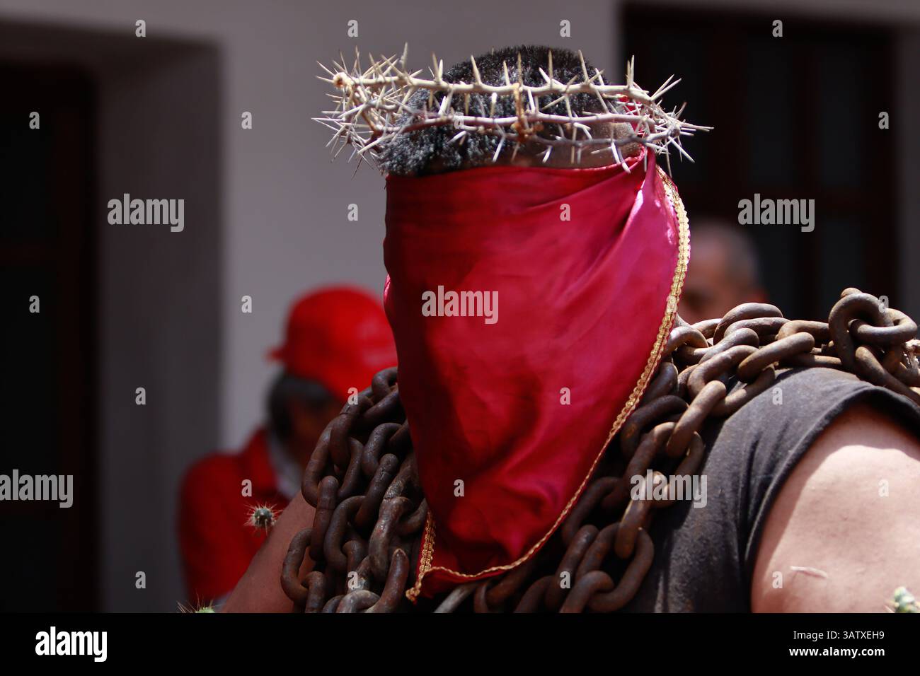 Atlixco, Mexico. 18th Apr, 2025. A penitent hooded carry heavy chains ...