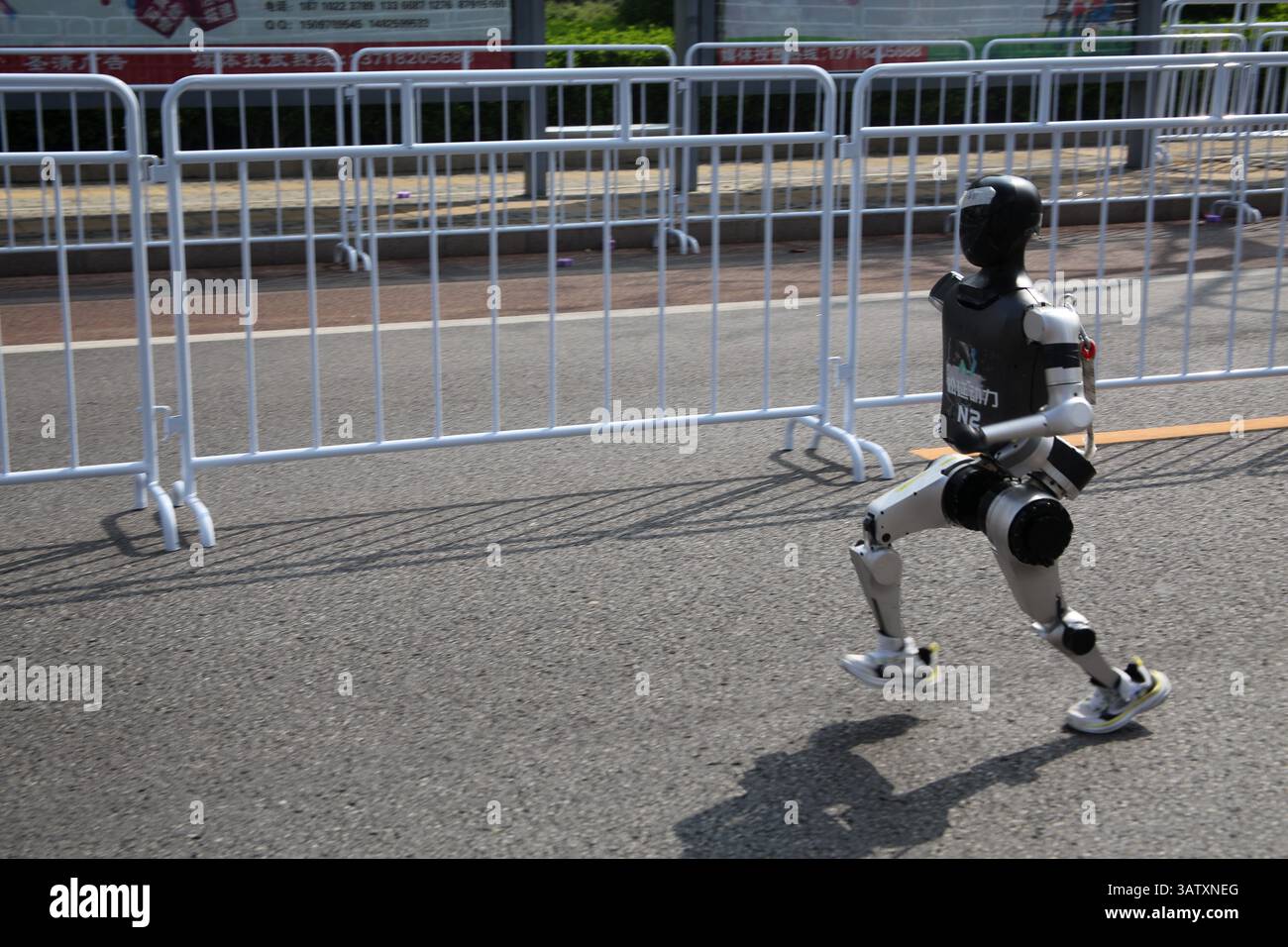 A humanoid robot participated in the world's first humanoid robot half ...