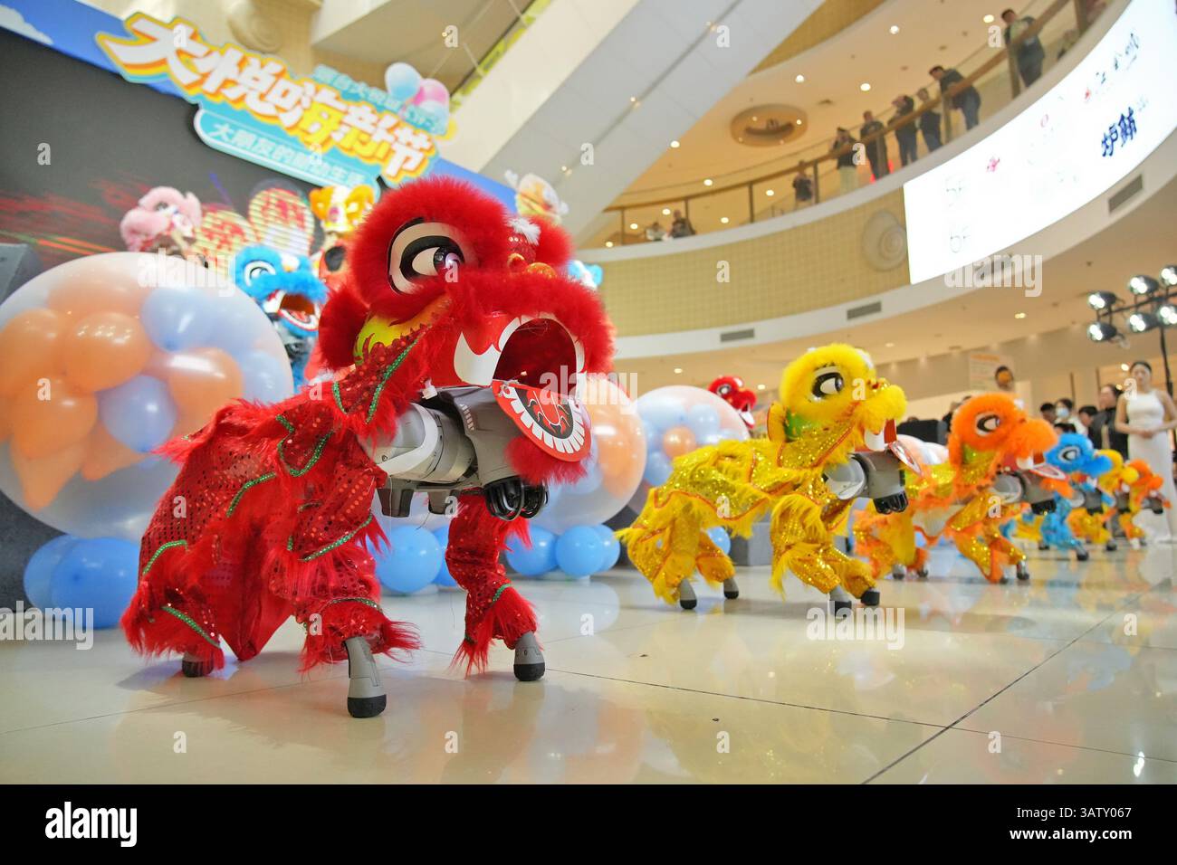 YANTAI, CHINA - APRIL 19, 2025 - Unitree Go2 robot dogs are performing ...