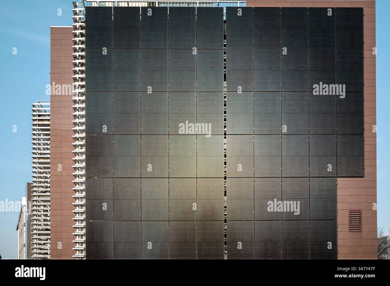 Solar panels photovoltaic power station on building facade. Alternative ...