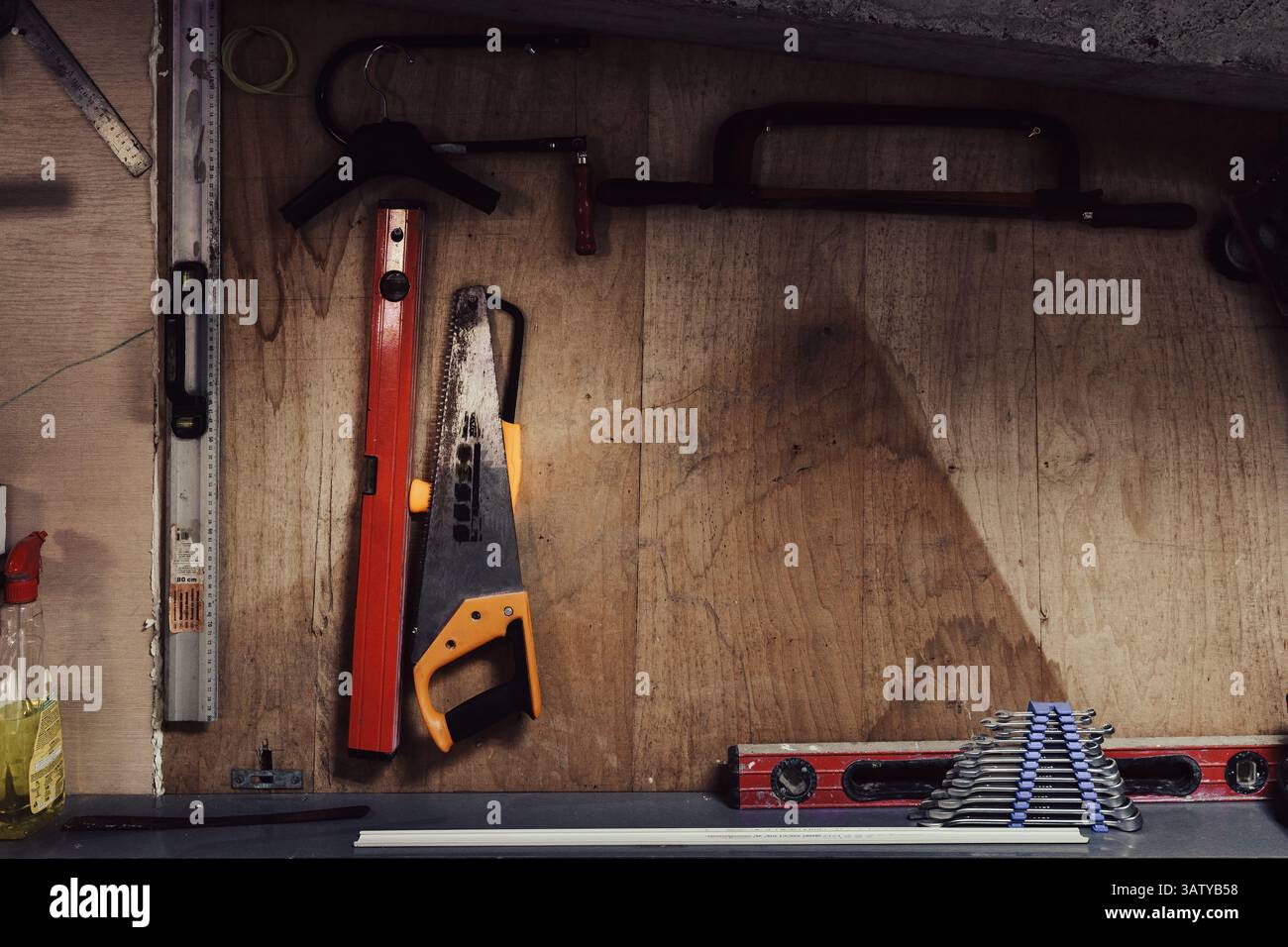 Details of a craft workshop, a wall with hanging tools Stock Photo - Alamy