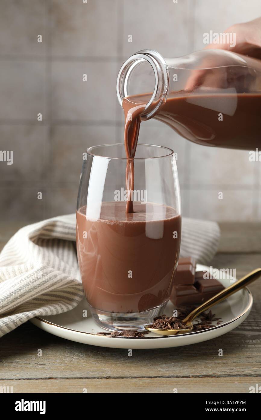 Woman pouring tasty chocolate milk hi-res stock photography and images ...