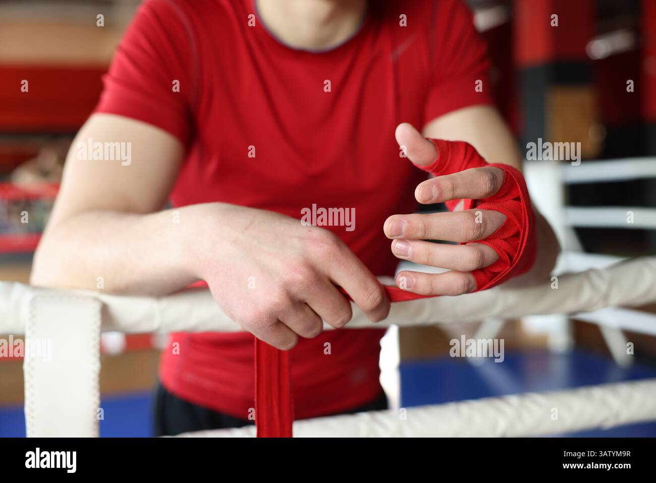 Man wrapping her hands on boxing ring, closeup Stock Photo - Alamy