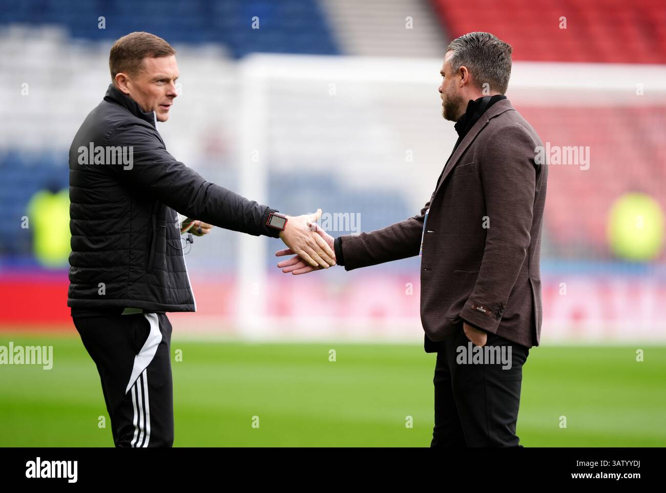 Referee John Beaton shakes hands with Aberdeen Manager Jimmy Thelin ...